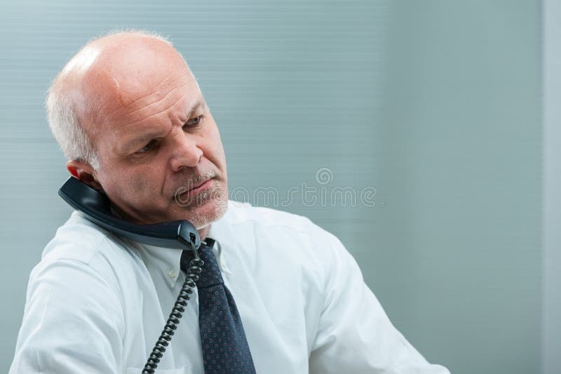 Senior Struggles with Confusing Phone Conversation Stock Photo - Image ...