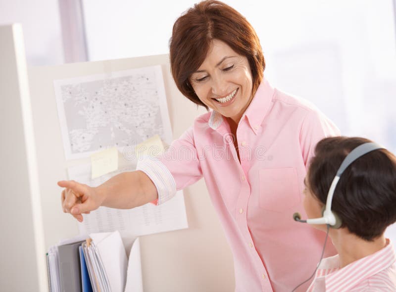 Senior Supervisor Helping Customer Care Operator Stock Photo - Image of ...
