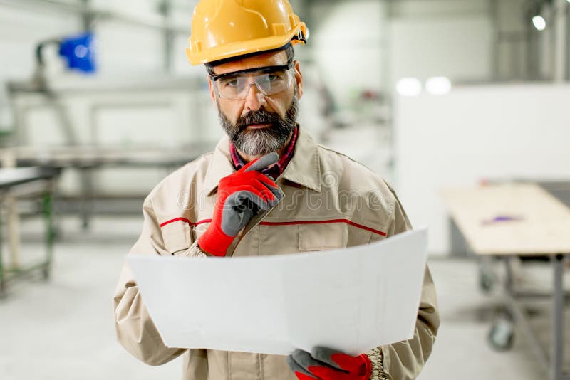 Senior Supervisor Looking at Projest in the Factory Stock Image - Image ...