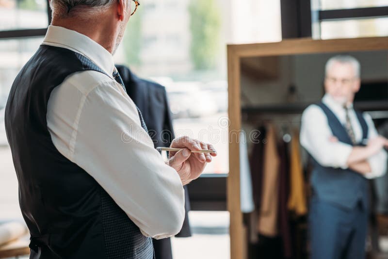 Senior Tailor Standing in Front of Mirror Stock Image - Image of person ...