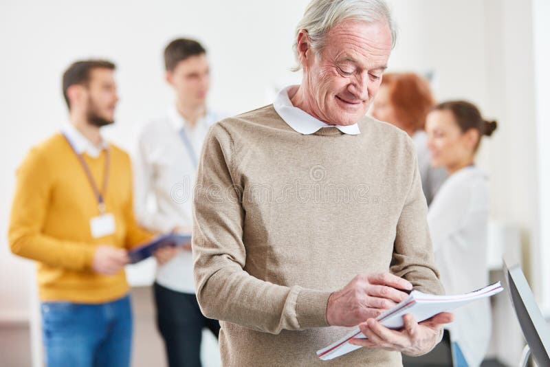 Senior Taking Notes during Meeting Stock Photo - Image of write ...