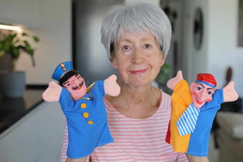 Senior Teacher Holding Some Cute Puppets Stock Photo - Image of police ...