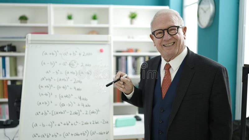 Senior Teaching Maths on Magnetic Board at University Classroom Stock ...