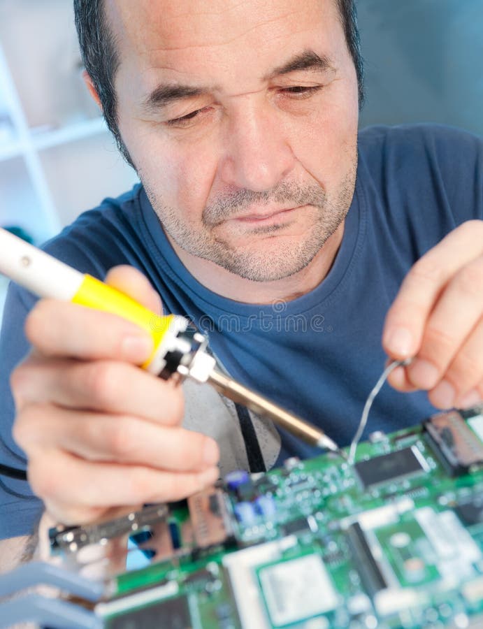 Senior Tech Works in Hartware Repair Facility Stock Image - Image of ...
