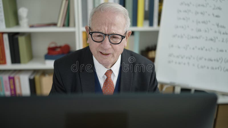 Senior University Teacher Using Computer at University Classroom Stock ...