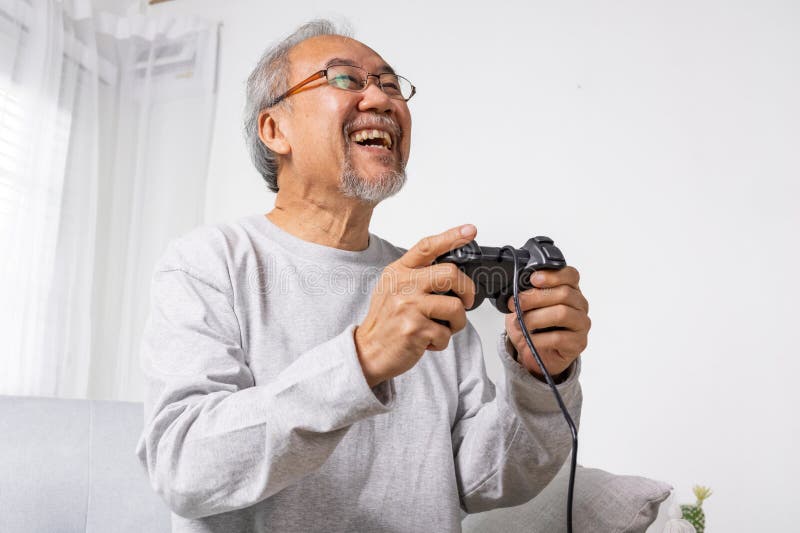 Senior Elderly Laughing on Sofa Using Controller Play Game Stock Image ...