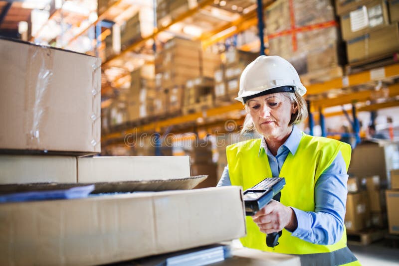 Senior Warehouse Woman Worker Working with Barcode Scanner. Stock Image ...