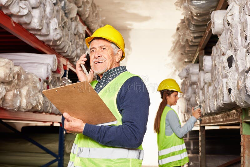 Senior Warehouse Worker Telephoned in the Warehouse Stock Photo - Image ...