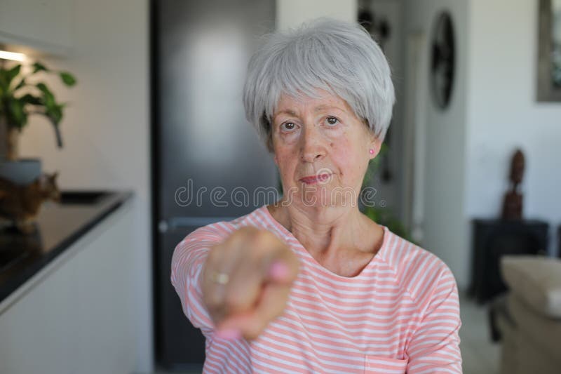 Senior Woman Accusing Someone of Doing Something Wrong with Hand ...