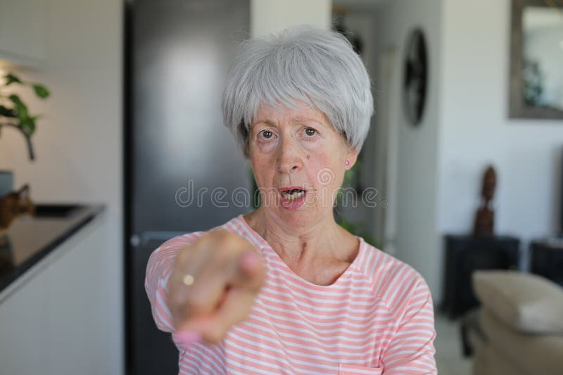 Senior Woman Accusing Someone of Doing Something Wrong with Hand ...