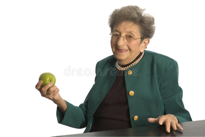 Senior woman with apple stock image. Image of management - 1628481