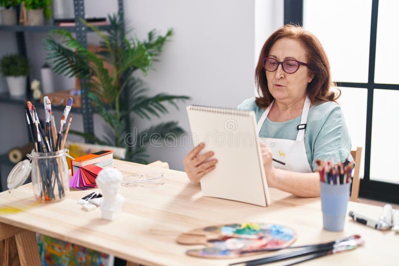 Senior Woman Artist Drawing on Notebook at Art Studio Stock Image ...