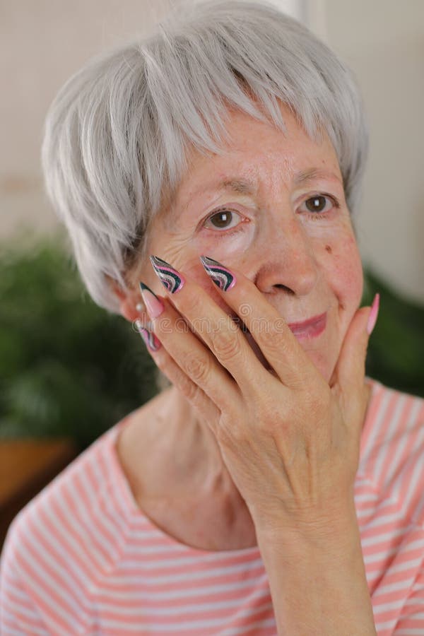 Senior Woman with Artsy Multicolored Long Nails Stock Photo - Image of ...