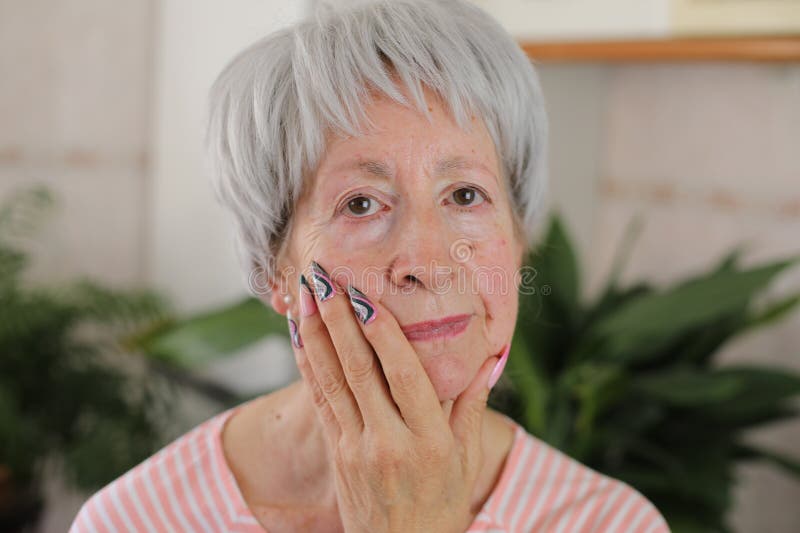 Senior Woman with Artsy Multicolored Long Nails Stock Photo - Image of ...