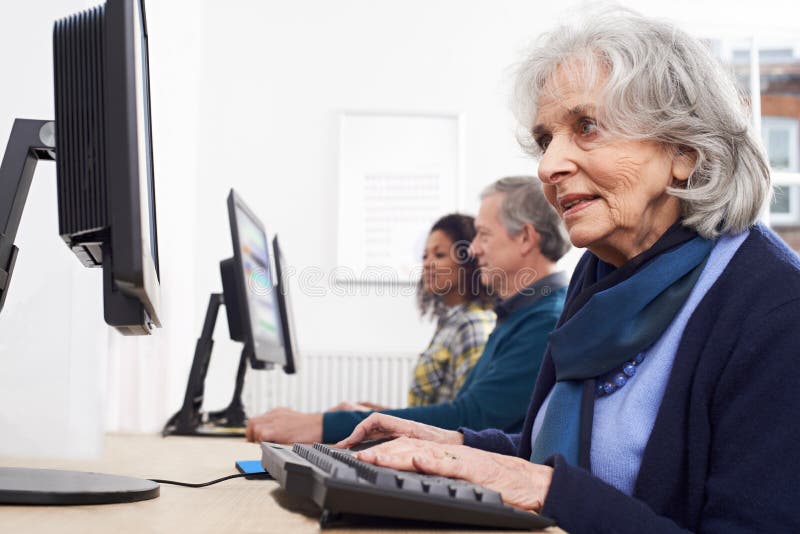 Senior Woman Attending Computer Class Stock Photo - Image of campus ...