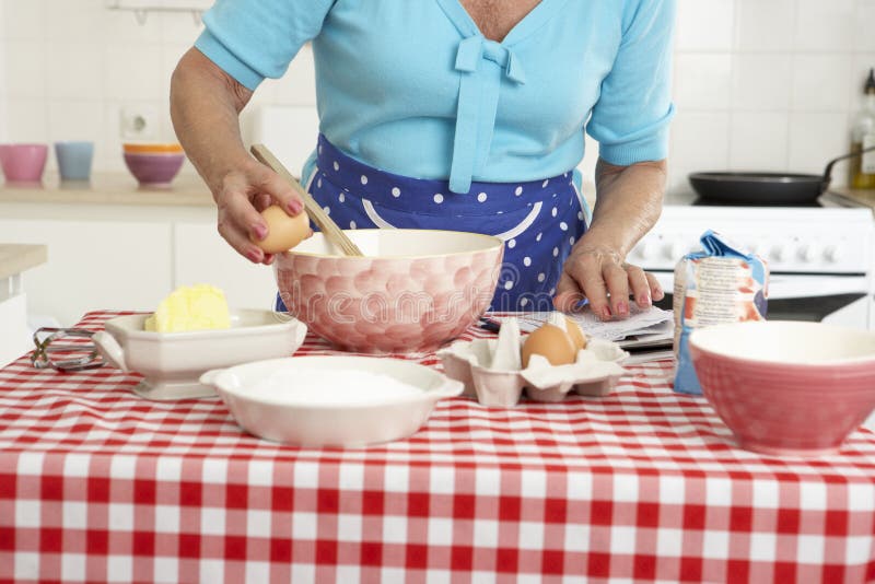Senior Woman Baking in Kitchen Stock Photo - Image of eggs, home: 54974232