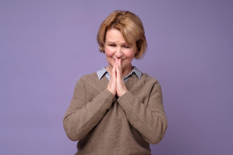 Senior Woman Begging and Praying with Hands Together with Hope ...