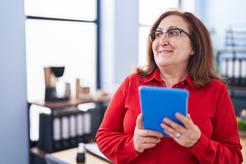 Senior Woman Business Worker Using Touchpad Working at Office Stock ...