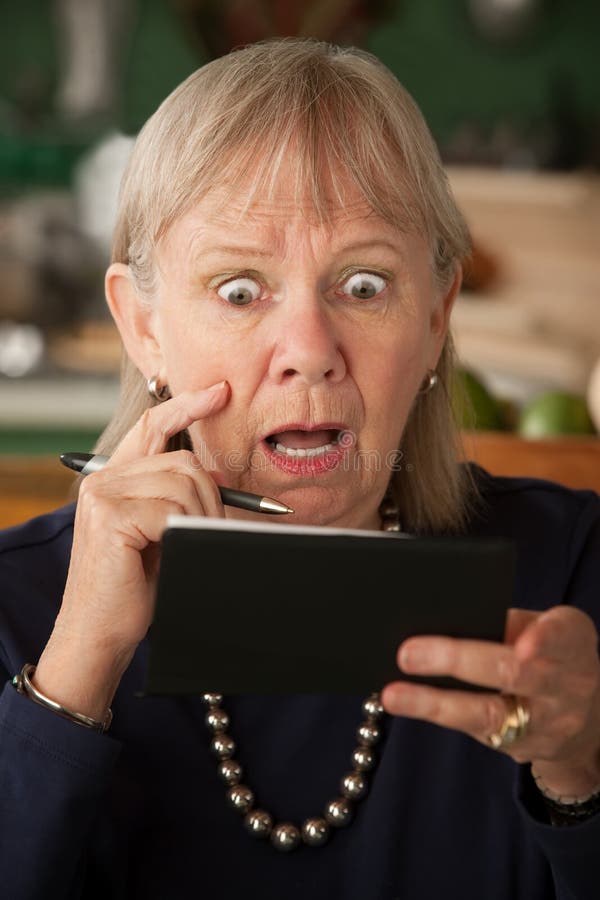 Senior Woman with Checkbook Stock Photo - Image of adult, kitchen: 16614318