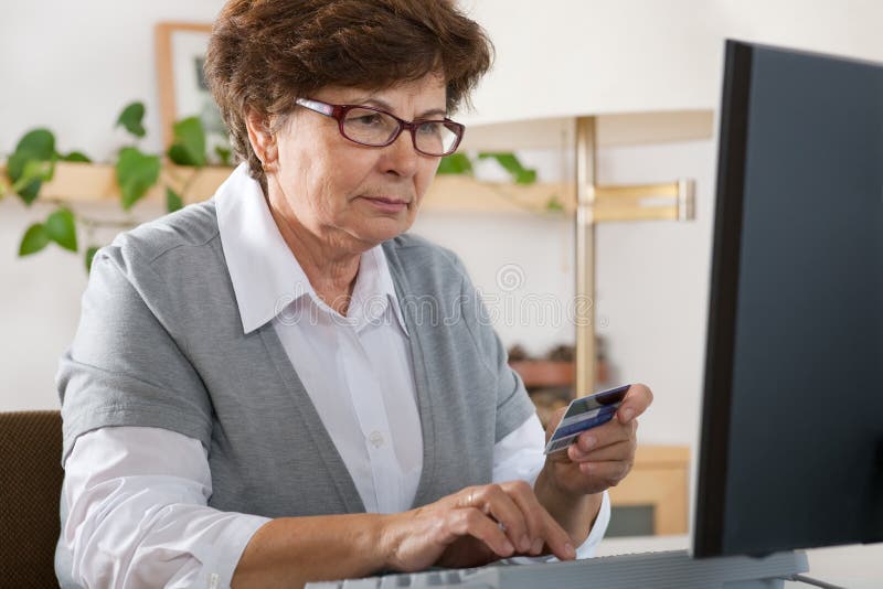 Senior woman on computer stock image. Image of grandmother - 11430493