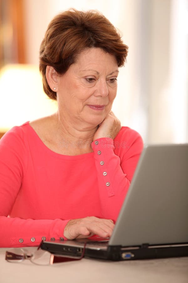 Senior woman with computer stock image. Image of internet - 15753645