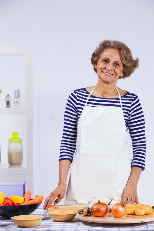 Senior woman cooking stock photo. Image of house, activity - 19781306