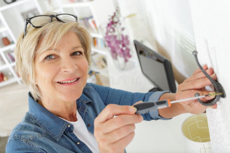 Senior woman doing diy stock image. Image of renovation - 188228935