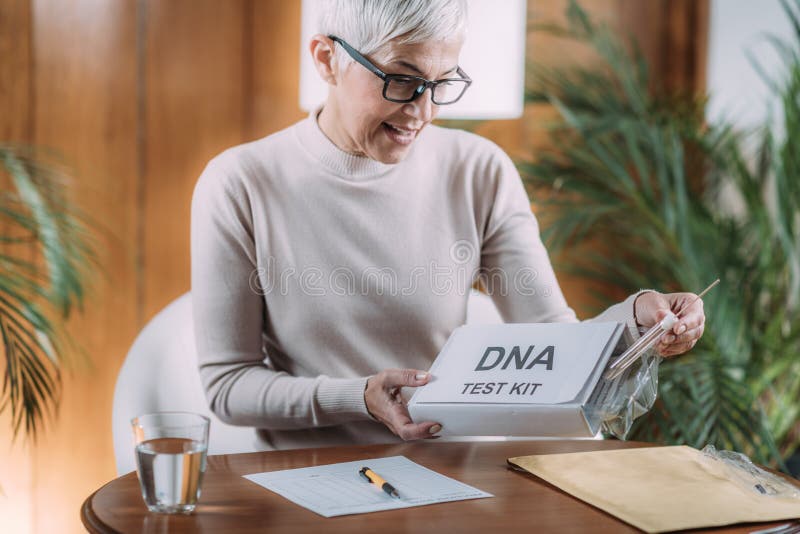 Senior Woman Doing a Mailed DNA Test at Home Stock Photo - Image of ...