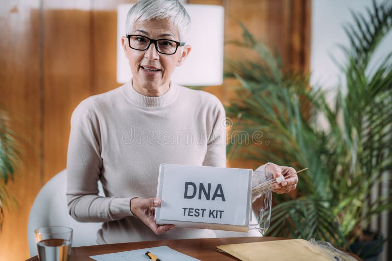 Senior Woman Doing a Mailed DNA Test at Home Stock Image - Image of ...