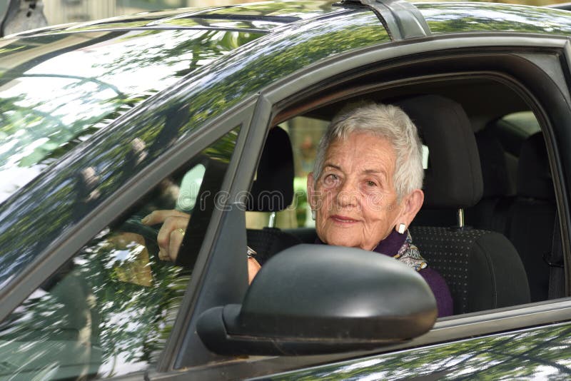 Senior woman driving a car stock image. Image of healthy - 96481645