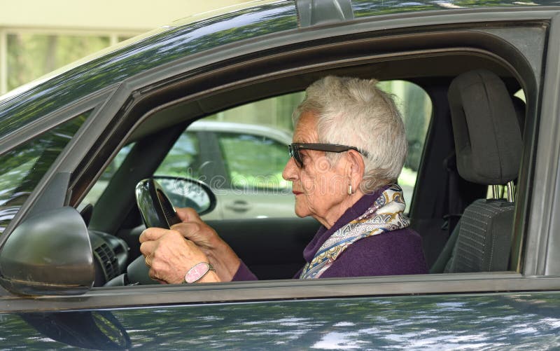 Senior woman driving a car stock photo. Image of casual - 96481750