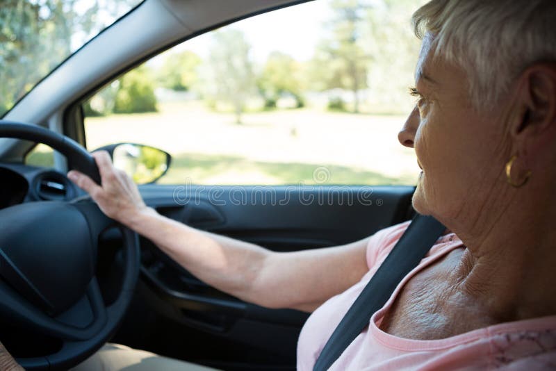 Senior woman driving a car stock photo. Image of caucasian - 97031786