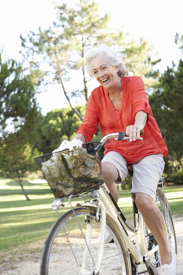 Senior Woman Enjoying Cycle Ride Stock Image - Image of senior, people ...