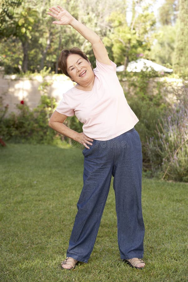 Senior Woman Exercising in Garden Stock Image - Image of quarter ...