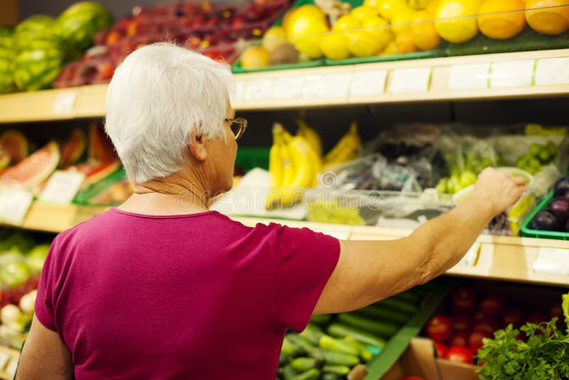 Senior Woman in Groceries Store Stock Image - Image of holding, color ...