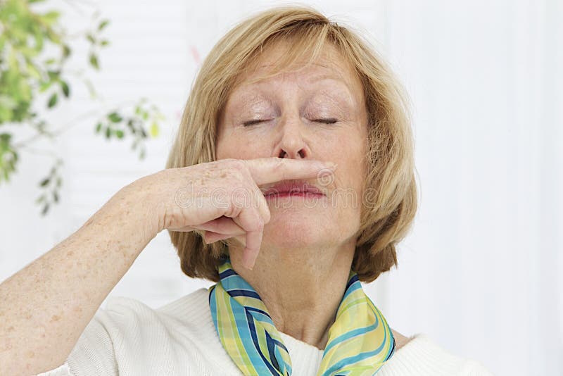 Senior woman having a cold stock image. Image of health - 39028881