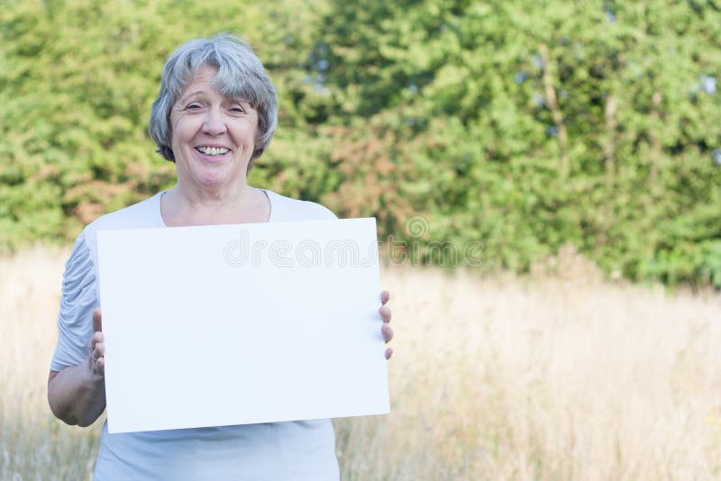 Senior Woman Holding Blank Sign Stock Image - Image of retirement ...