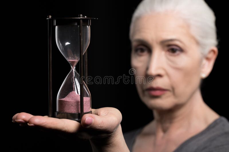 Senior Woman Holding Sand Clock Stock Image - Image of person, european ...
