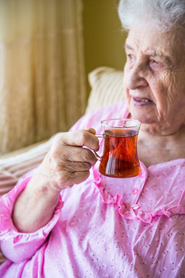 Senior woman holding tea stock photo. Image of holding - 43463116