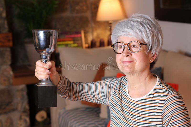 Senior Woman Holding a Trophy Stock Image - Image of activity ... Senior Woman Holding a Trophy Stock Image - Image of activity ...