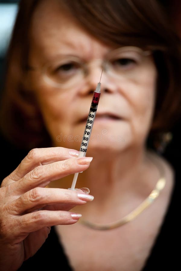 Senior Woman with Hypodermic Needle Stock Image - Image of person ...
