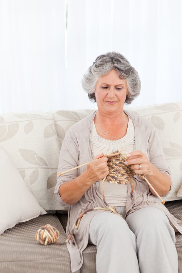 Senior Woman Knitting on Her Sofa Stock Image - Image of beautiful ...