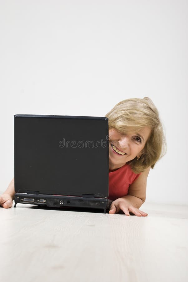 Senior Woman Laughing Behind a Laptop Stock Image - Image of health ...