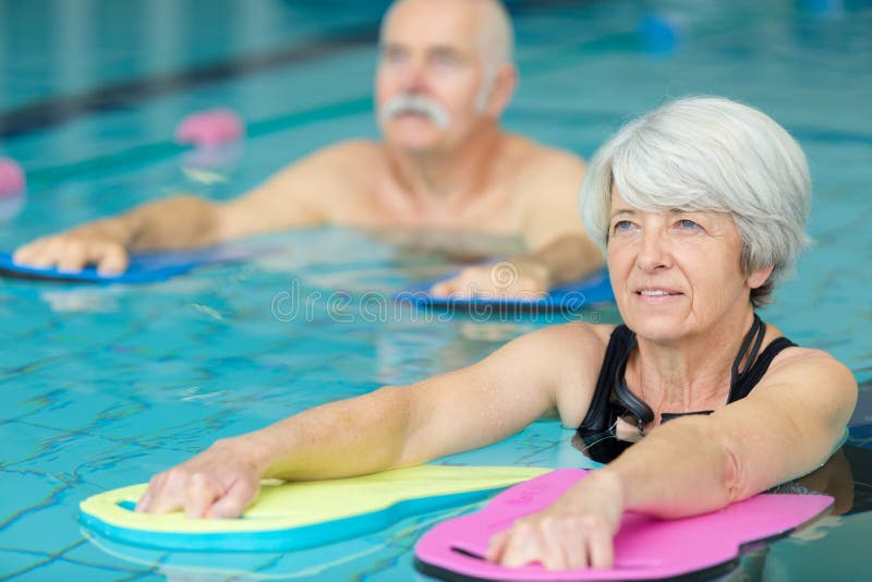 Senior Woman Learning To Swim in Pool Stock Image - Image of ...