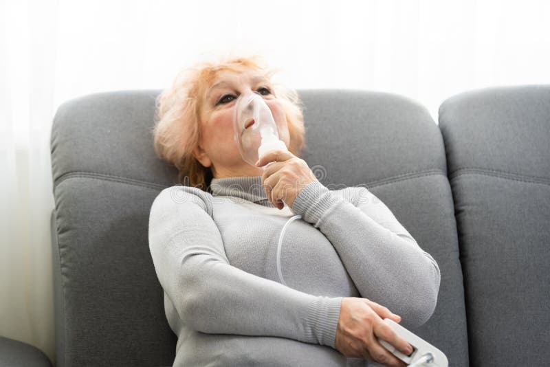 Senior Woman Making Inhalation, Elderly Woman and Nebulizer Stock Photo ...