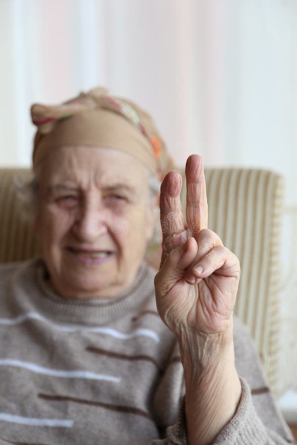 Senior Woman Making Victory Sign Stock Image - Image of corporate ...