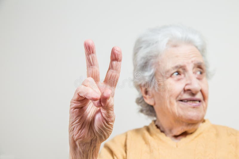 Senior Woman Making Victory (V) Sign Stock Photo - Image of pretty ...