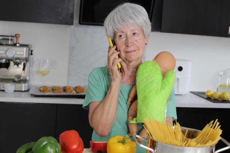 Senior Woman Multitasking in the Kitchen Stock Photo - Image of busy ...