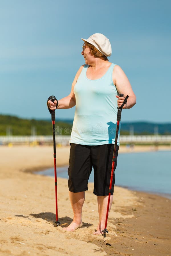 Senior Woman Practicing Nordic Walking on Beach Stock Image - Image of ... Senior Woman Practicing Nordic Walking on Beach Stock Image - Image of ...