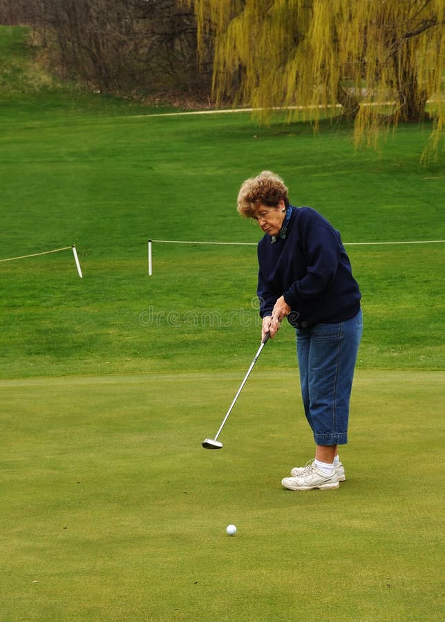 Senior Woman Putting on the Green Stock Photo - Image of putting, adult ...